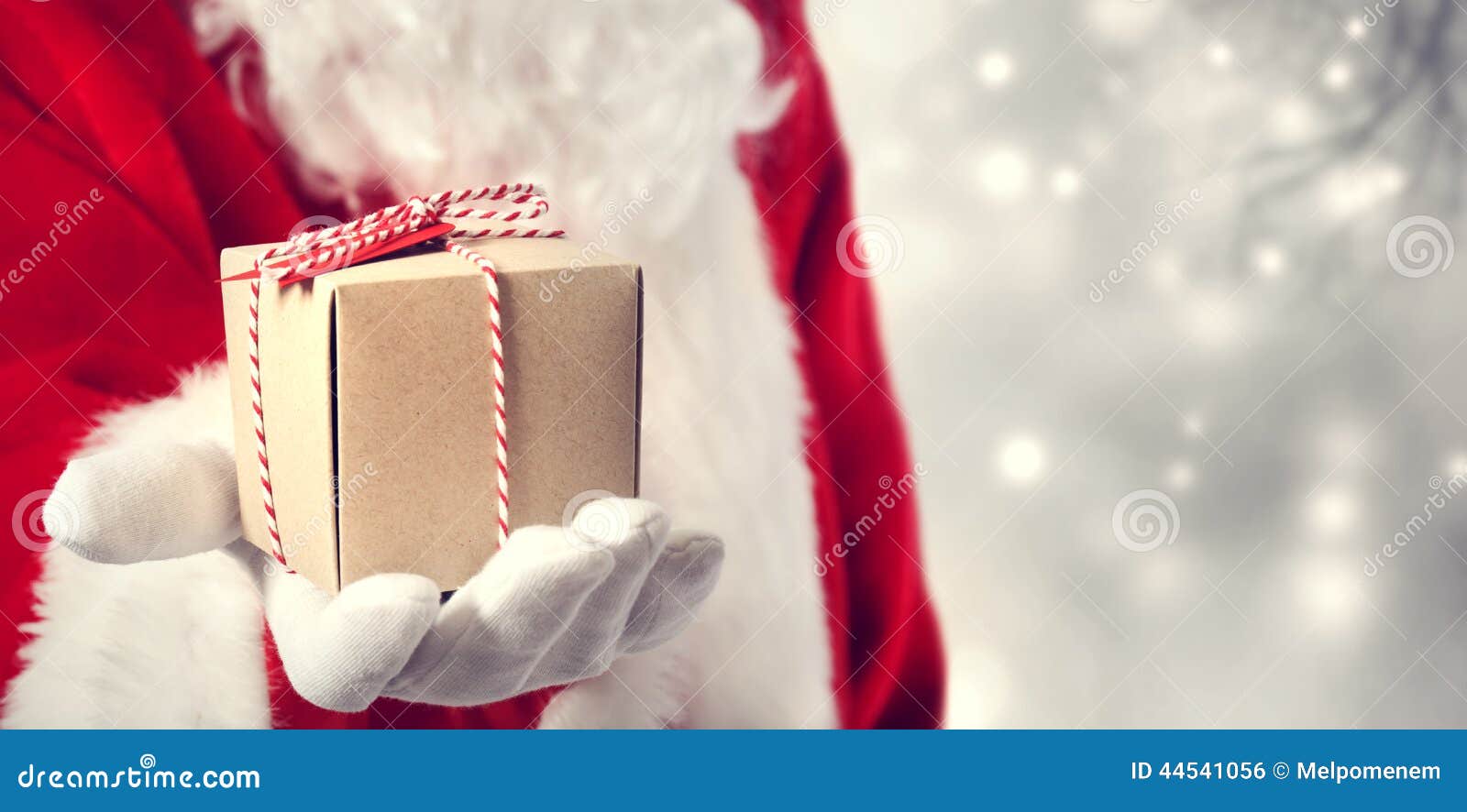 Santa Claus giving a gift stock photo. Image of christmas - 44541056