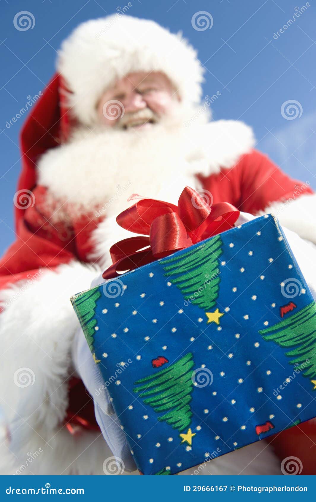 Santa Claus Giving a Present Stock Image - Image of costume, santa ...