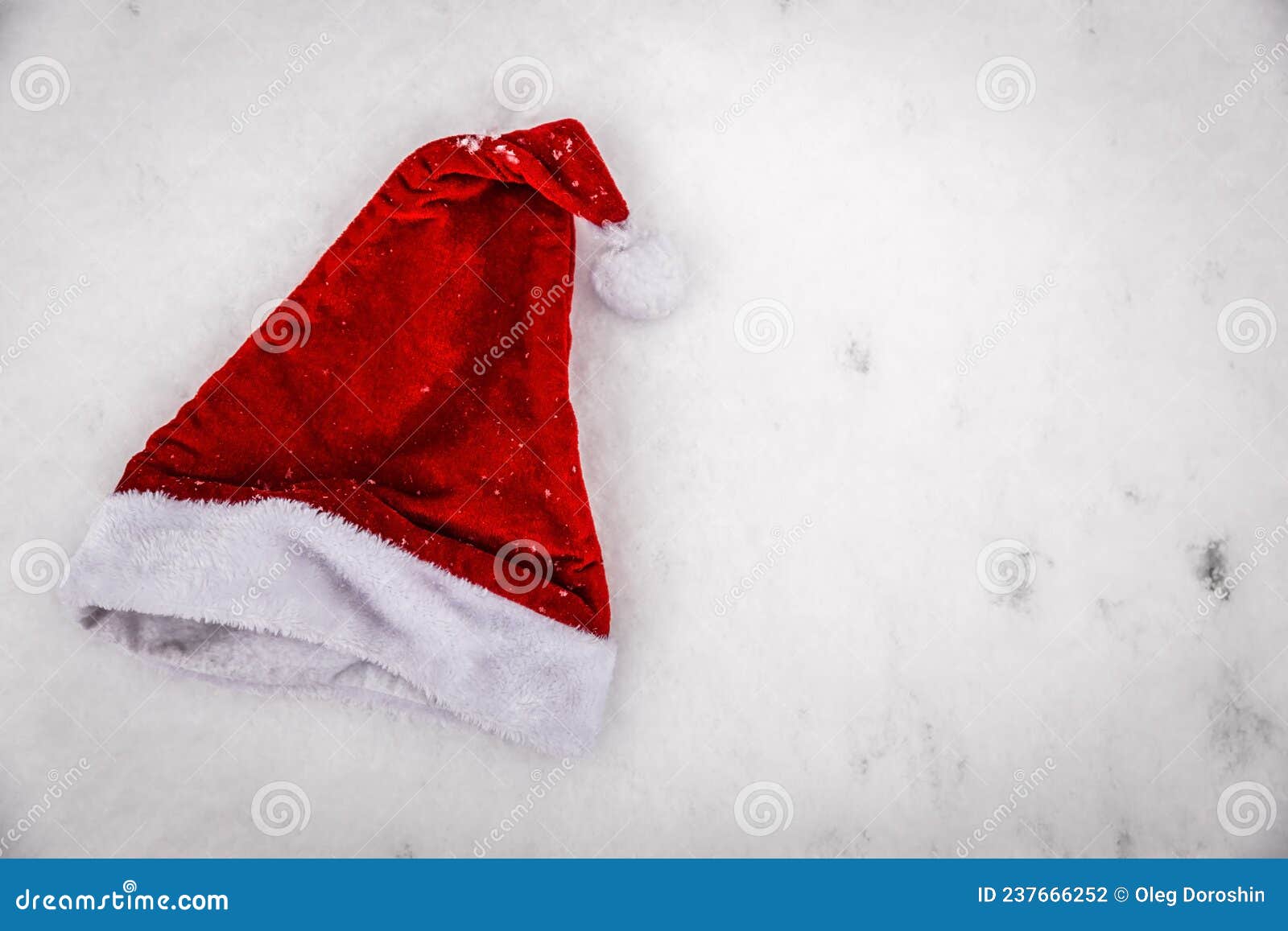 Santa Claus Hat in the Snow Abandoned or Forgotten Stock Photo - Image ...
