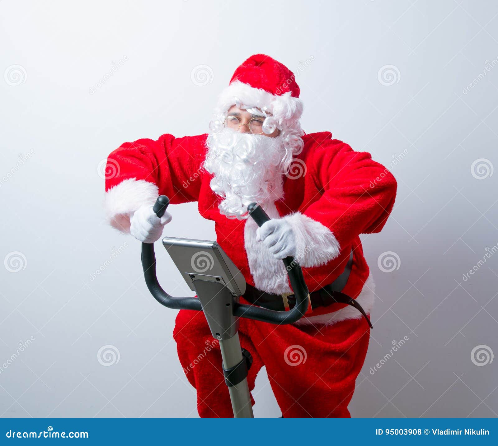 Santa Claus Have a Fun with Exercise Bikes Stock Photo - Image of ...