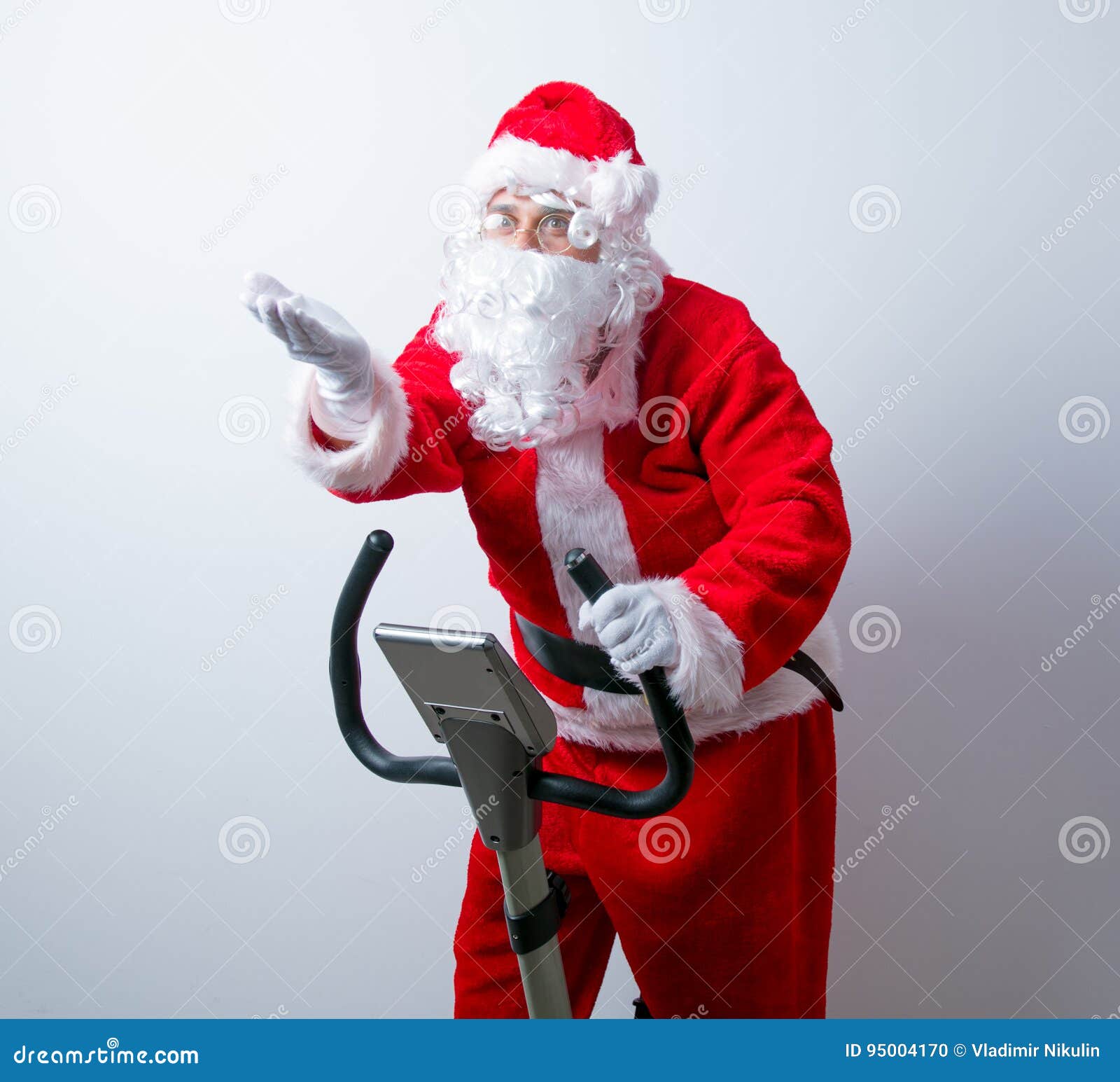 Santa Claus Have a Fun with Exercise Bikes Stock Photo - Image of ...