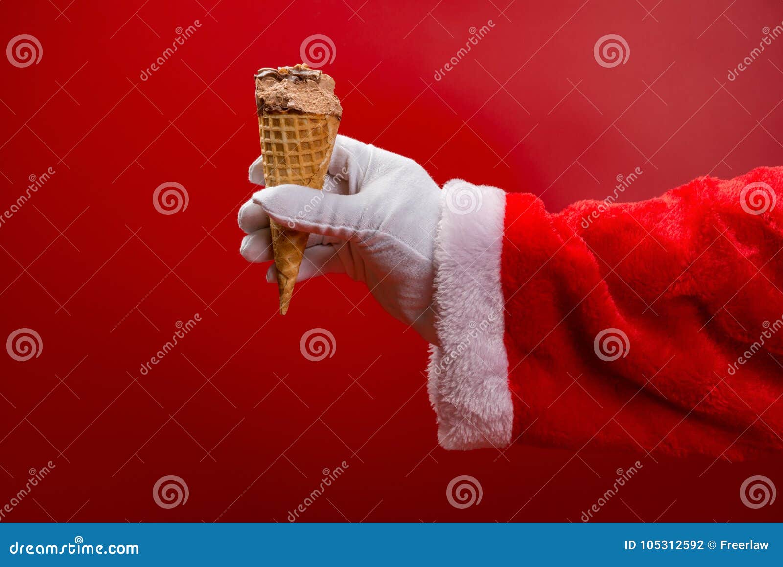 Santa Claus Holding an Ice Cream Cone with a Bite Stock Photo - Image ...