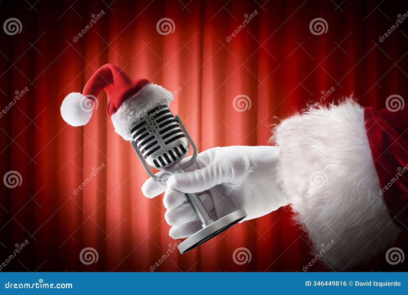 Santa Claus Holding a Retro Microphone and Red Backdrop Stock Photo ...