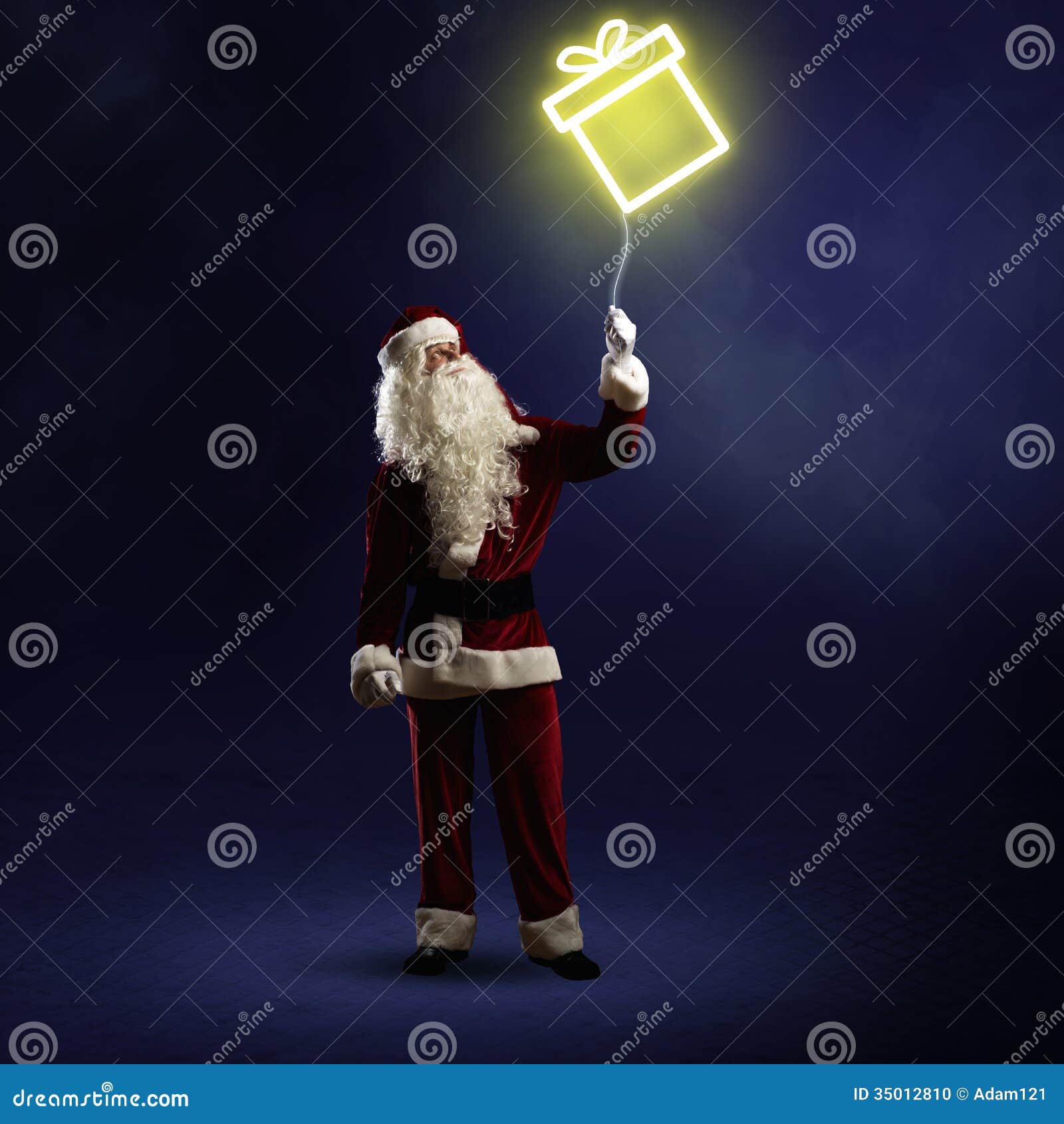 Santa Claus is Holding a Shining Gift Stock Photo - Image of claus ...