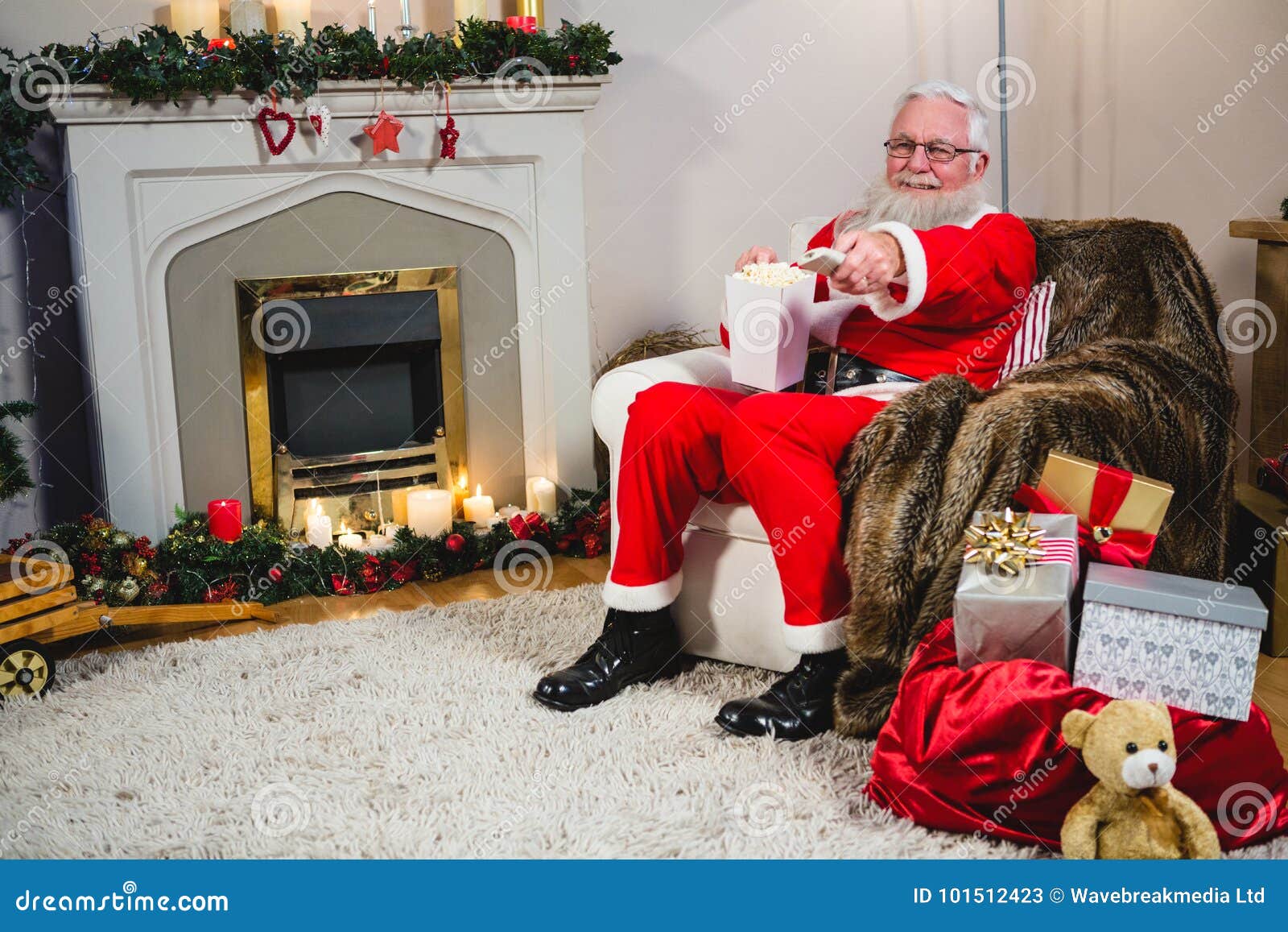 Santa Claus Holding Television Remote Control Image stock - Image du ...