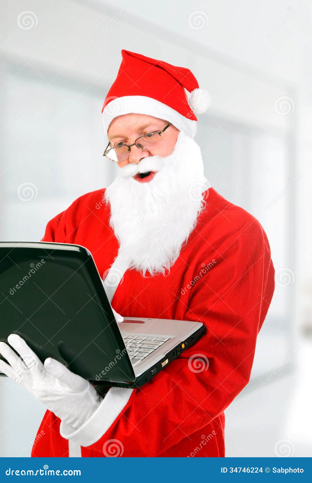 Santa Claus with Laptop stock photo. Image of coat, noel - 34746224