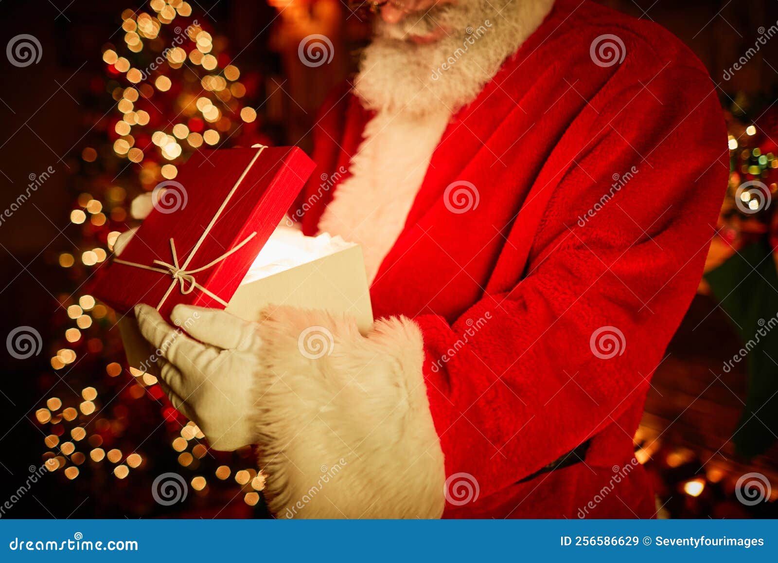 Santa Claus Opening Present Stock Image - Image of night, magic: 256586629