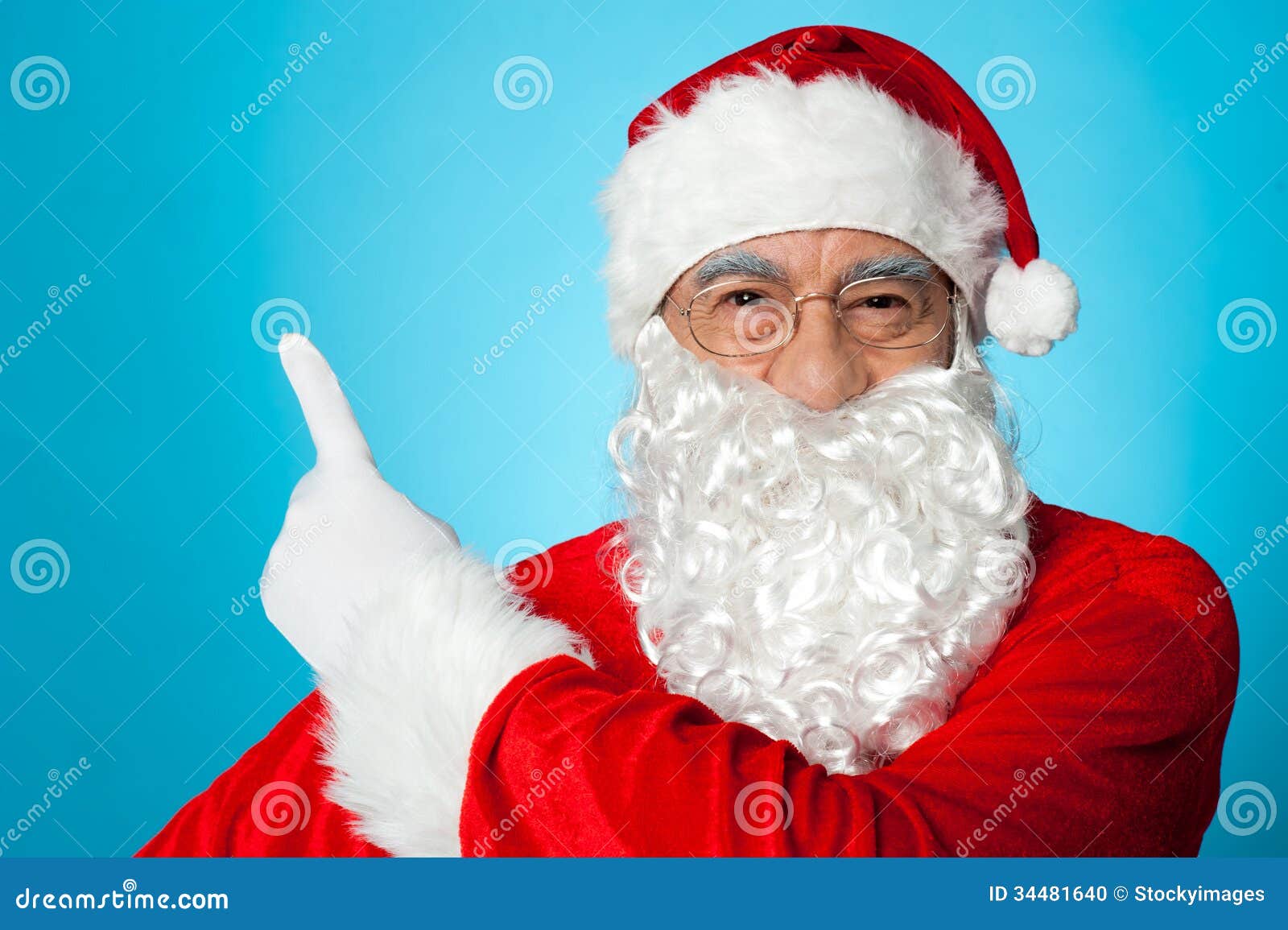 Santa claus pointing away stock photo. Image of season - 34481640