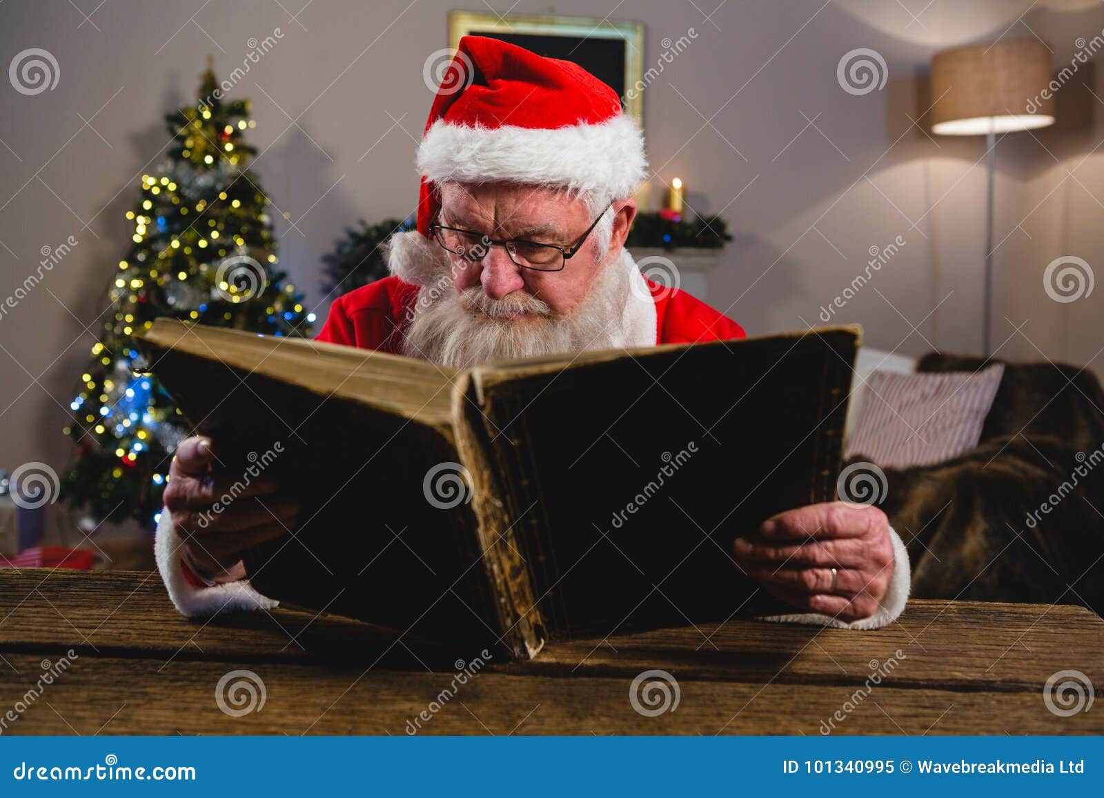 Santa Claus reading book stock image. Image of attentive - 101340995