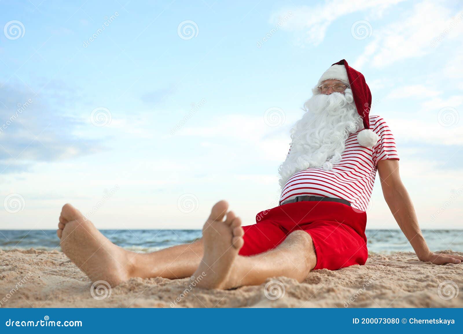 Santa Claus Relaxing on Beach, Space for Text. Christmas Vacation Stock ...