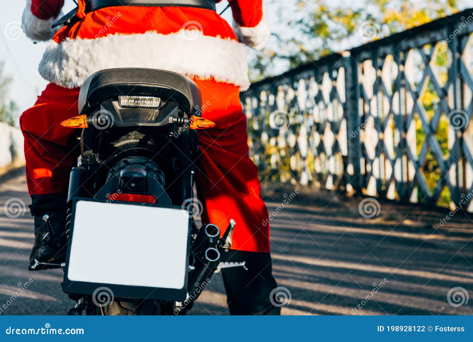 Santa Claus Riding a Motorcycle on His Back Wit Copy Space for Text ...