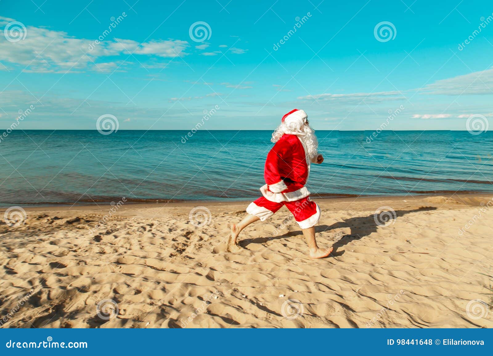 Santa Claus Runs Along the Beach. Stock Photo - Image of people, claus ...