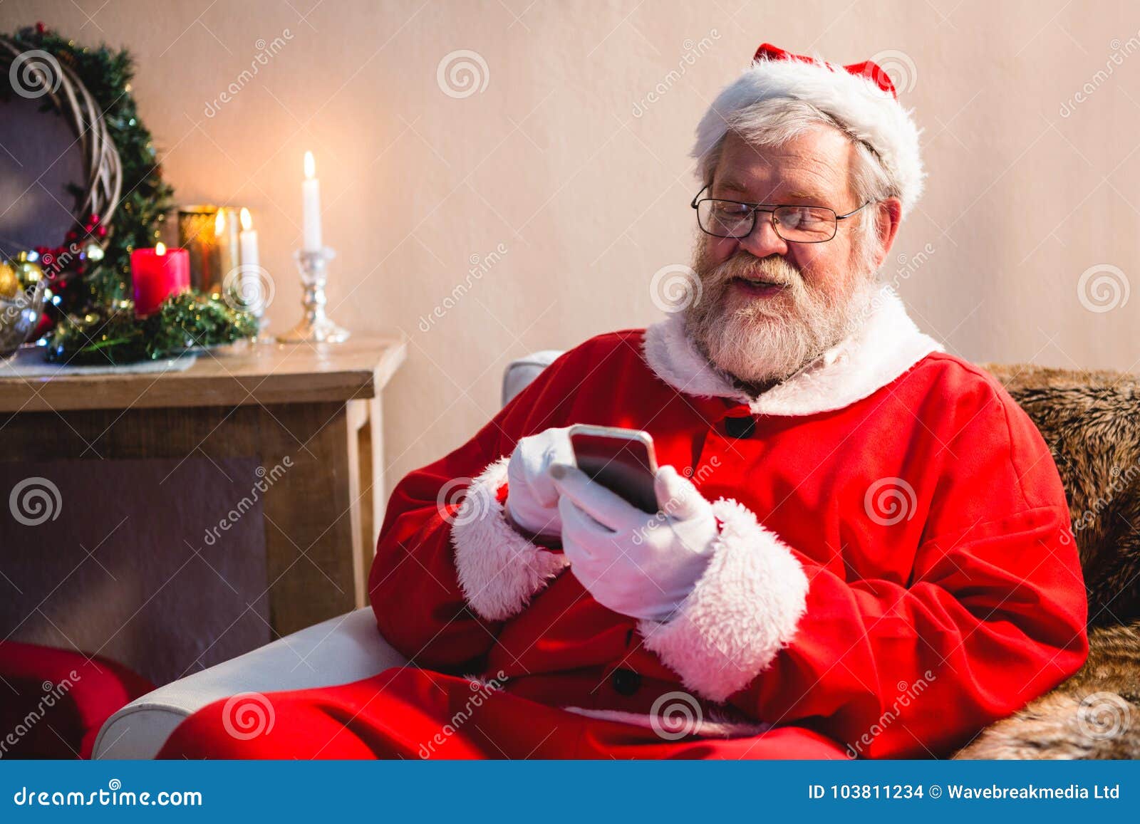 Santa Claus Sitting and Using Mobile Phone Stock Photo - Image of ...