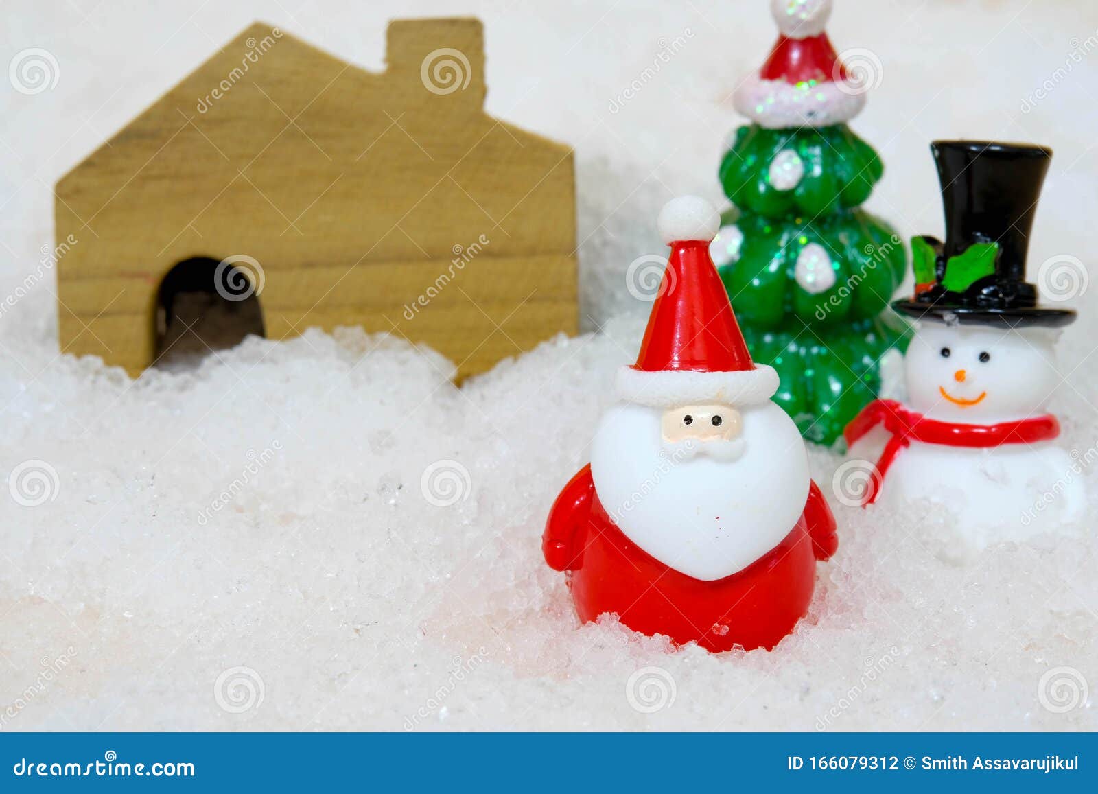 Santa Claus And Snowman And Christmas Tree And Wooden House On White