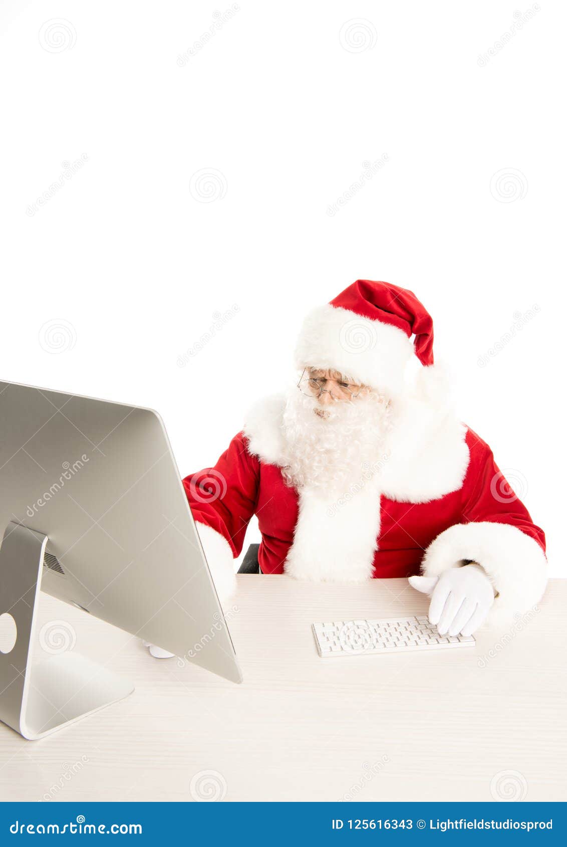 Santa Claus using computer stock image. Image of holiday - 125616343