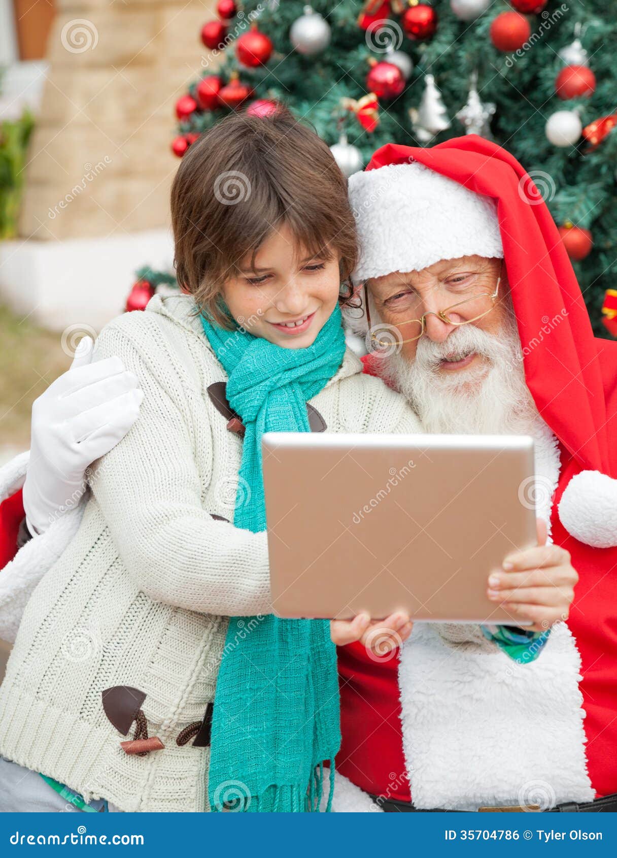 Santa Claus Using Digital Tablet with Boy Stock Photo - Image of ...