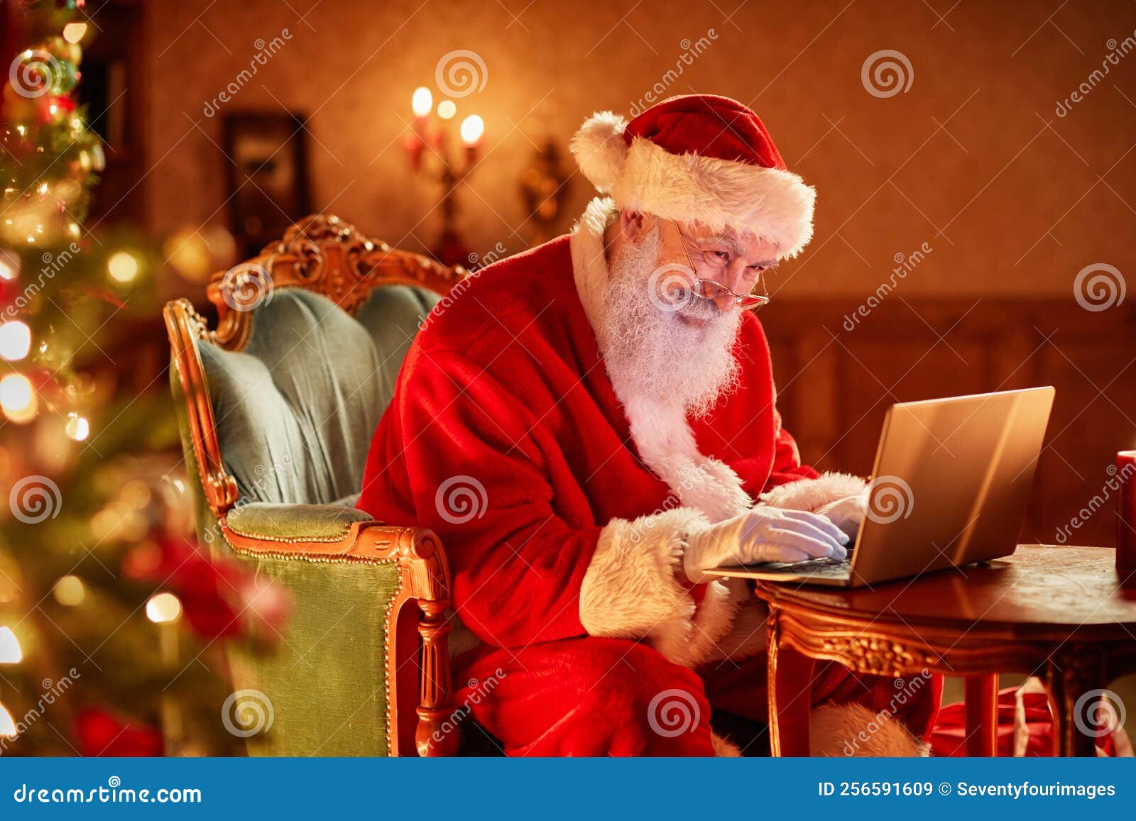 Santa Claus Using Laptop stock image. Image of celebration - 256591609