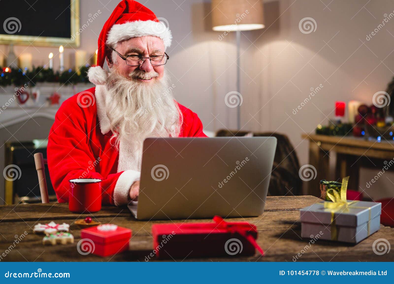 Santa Claus Using Laptop on Table Stock Photo - Image of saint ...