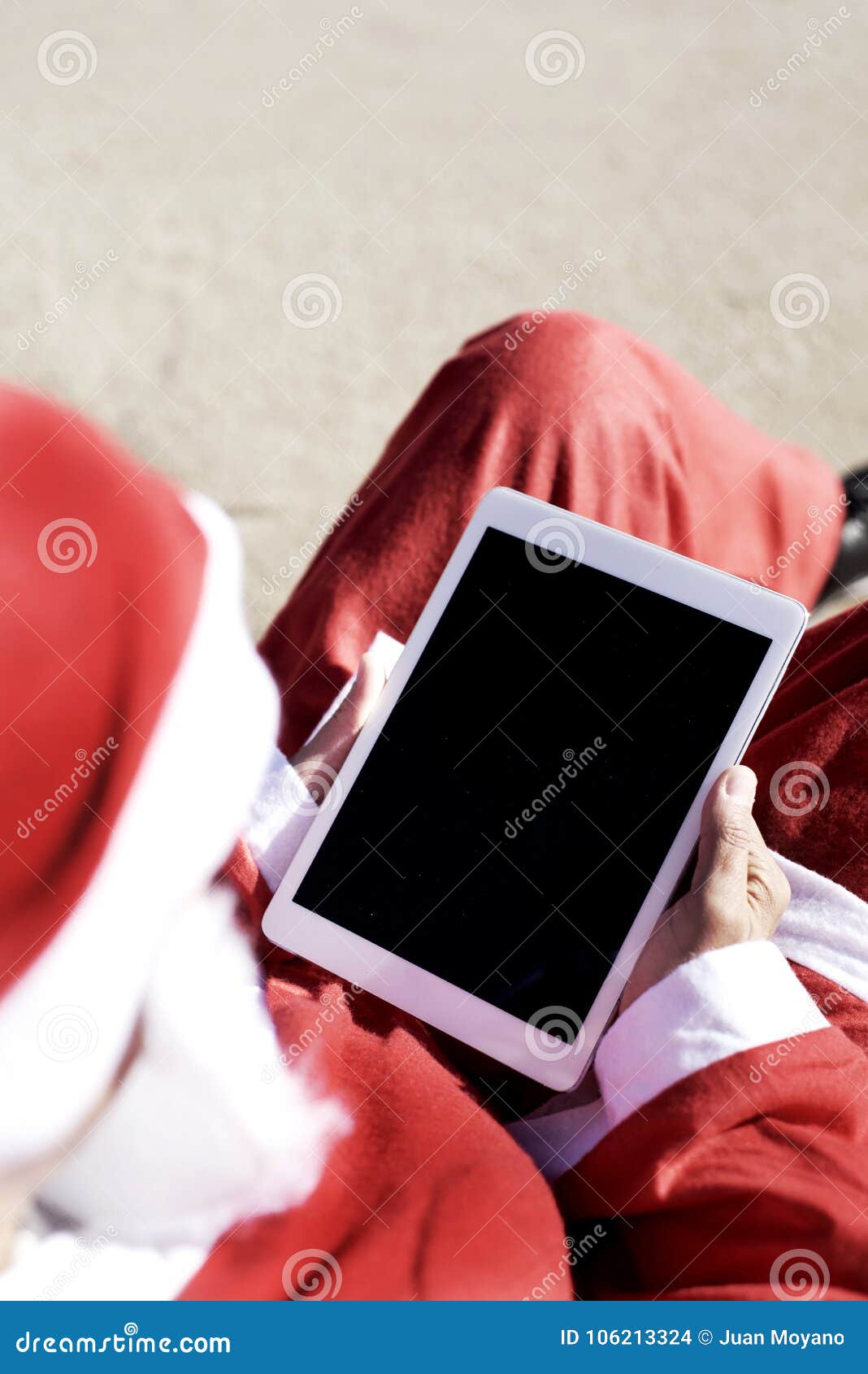Santa Claus Using a Tablet on the Beach Stock Photo - Image of device ...