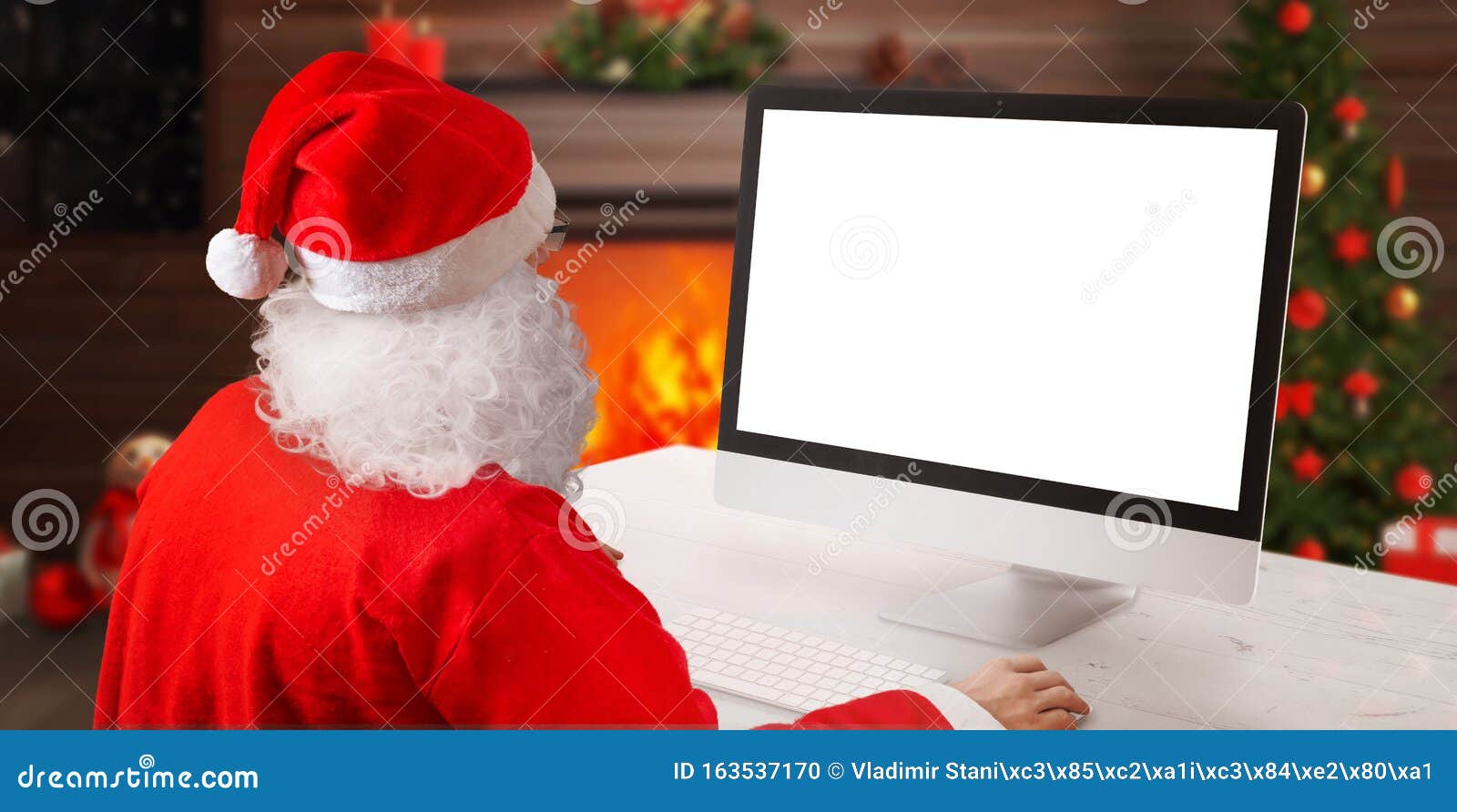 Santa Claus Work on Computer beside Fireplace and Christmas Tree Stock ...