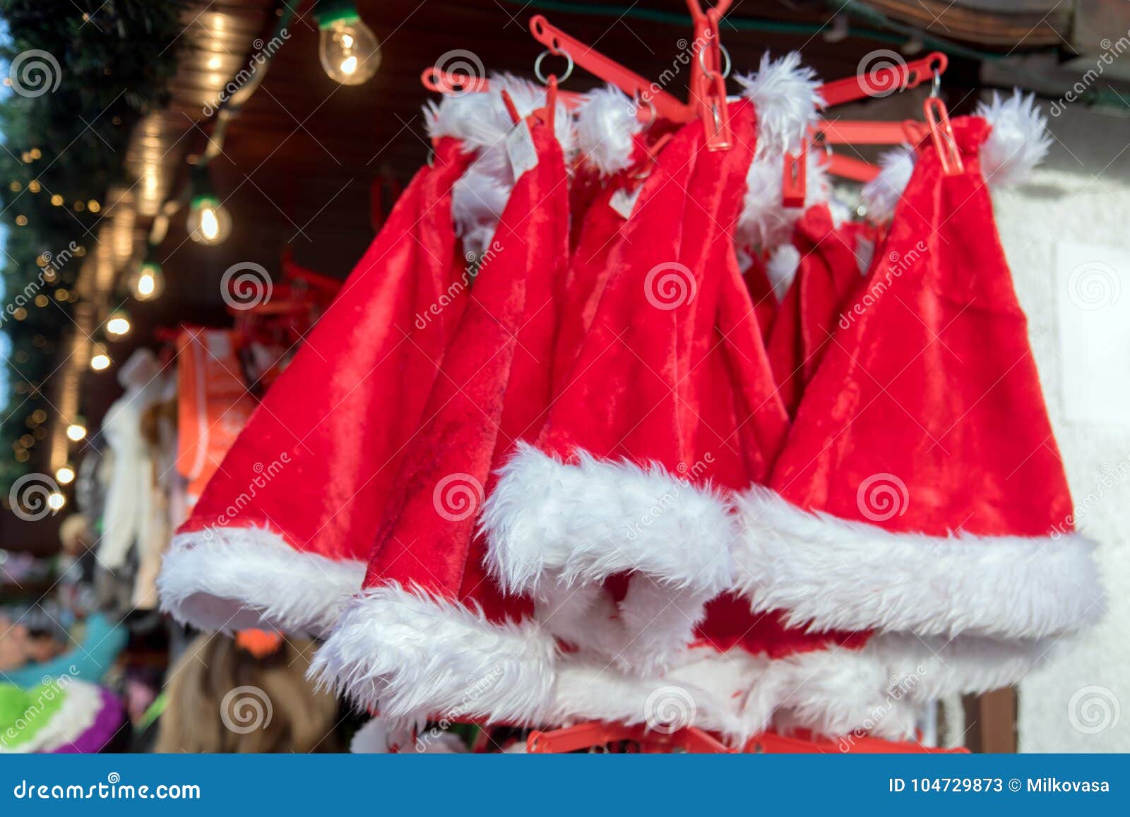 Santa Clause Hat Hanging in a Market Stall. Stock Image - Image of ...