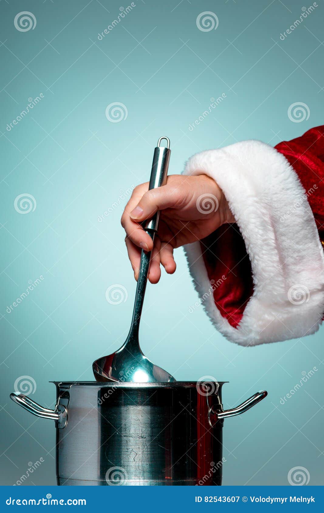 The Santa Hand Holding a Ladle or Kitchen Spoon Stock Image - Image of ...