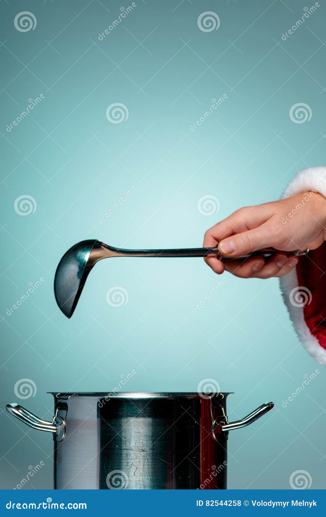 The Santa Hand Holding a Ladle or Kitchen Spoon Stock Photo - Image of ...