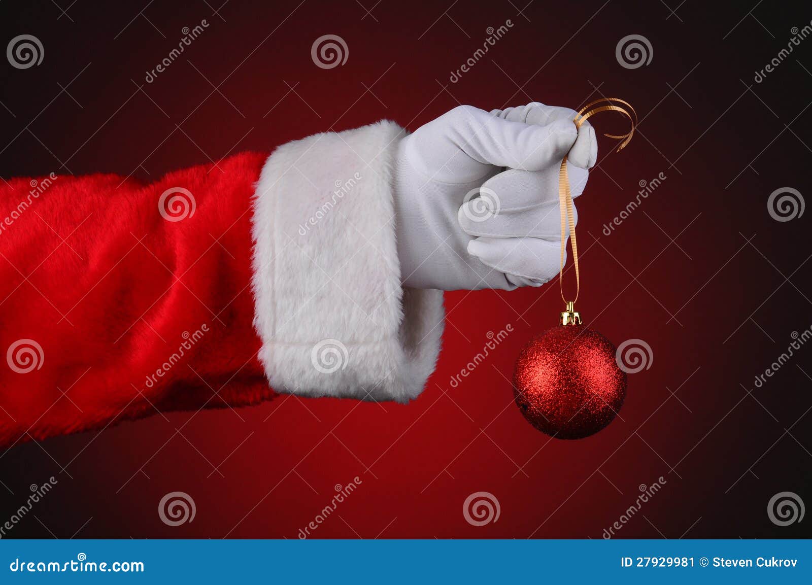 Santa Hand Holding Red Ornament Stock Image - Image of claus, december ...