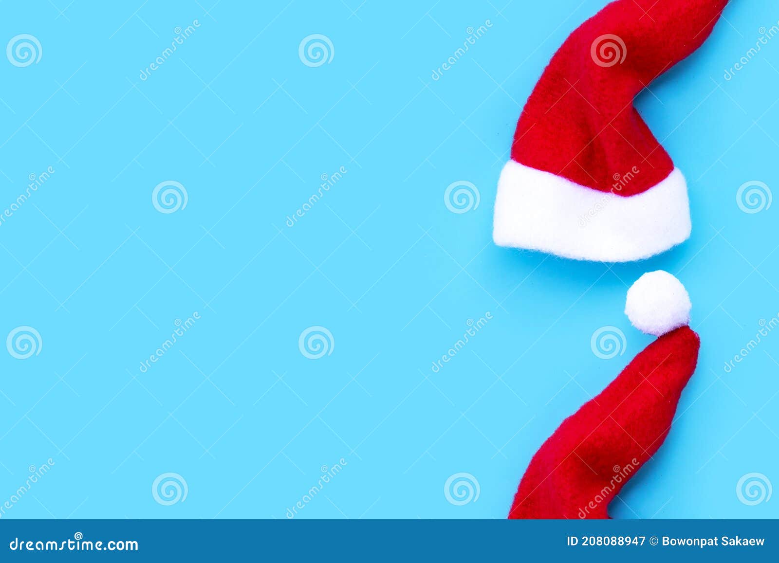 Santa Hats on Blue Background Stock Image - Image of concept, bauble ...
