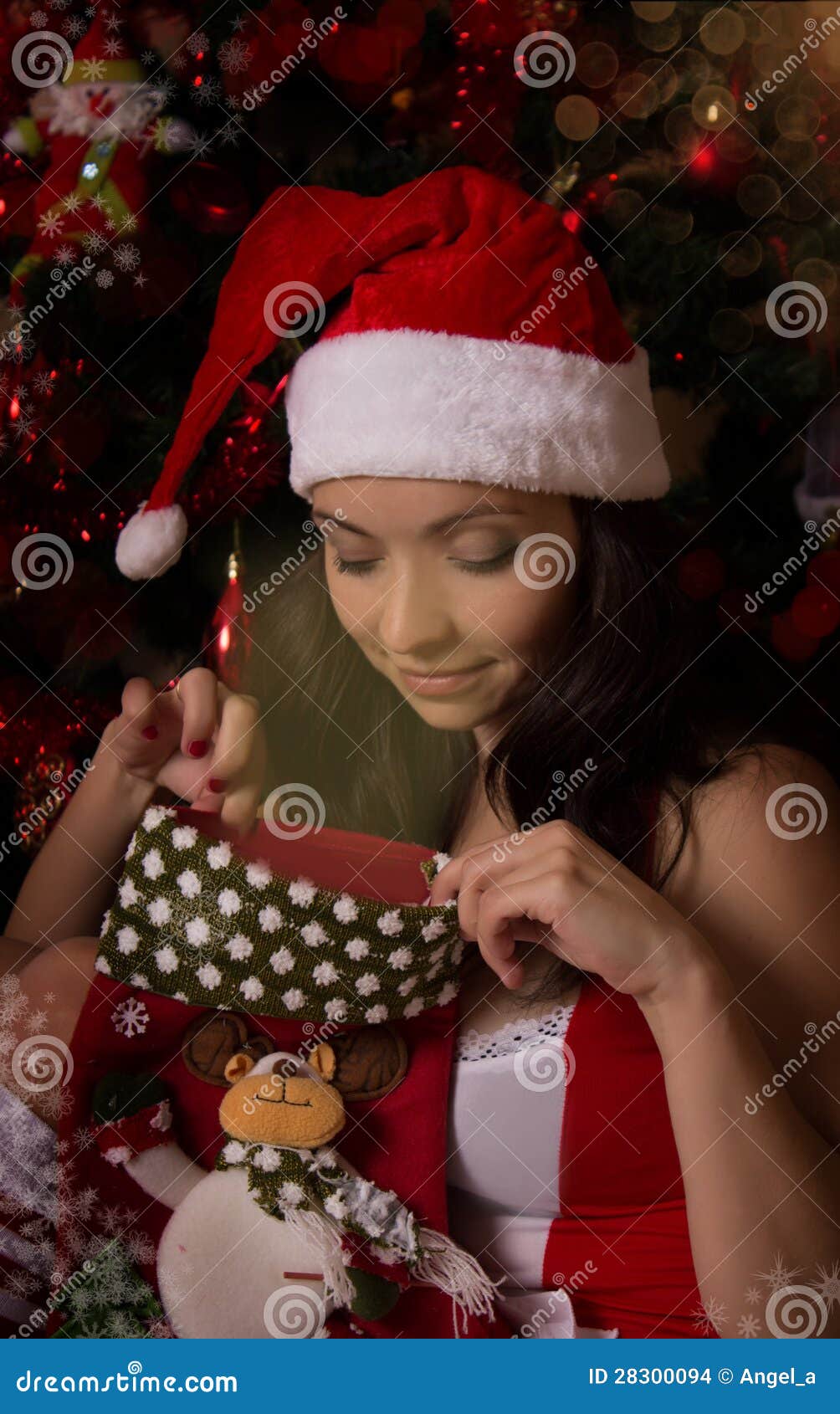 Santa Helper Looking Inside Christmas Sock Stock Photo - Image of cute ...
