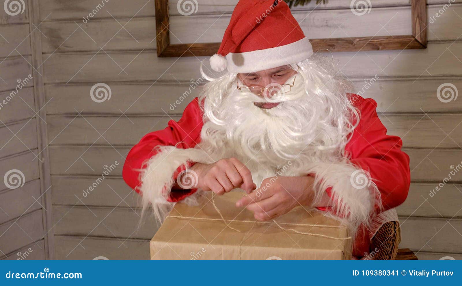 Santa is Holding a Big Gift Box in His Hand Stock Image - Image of ...