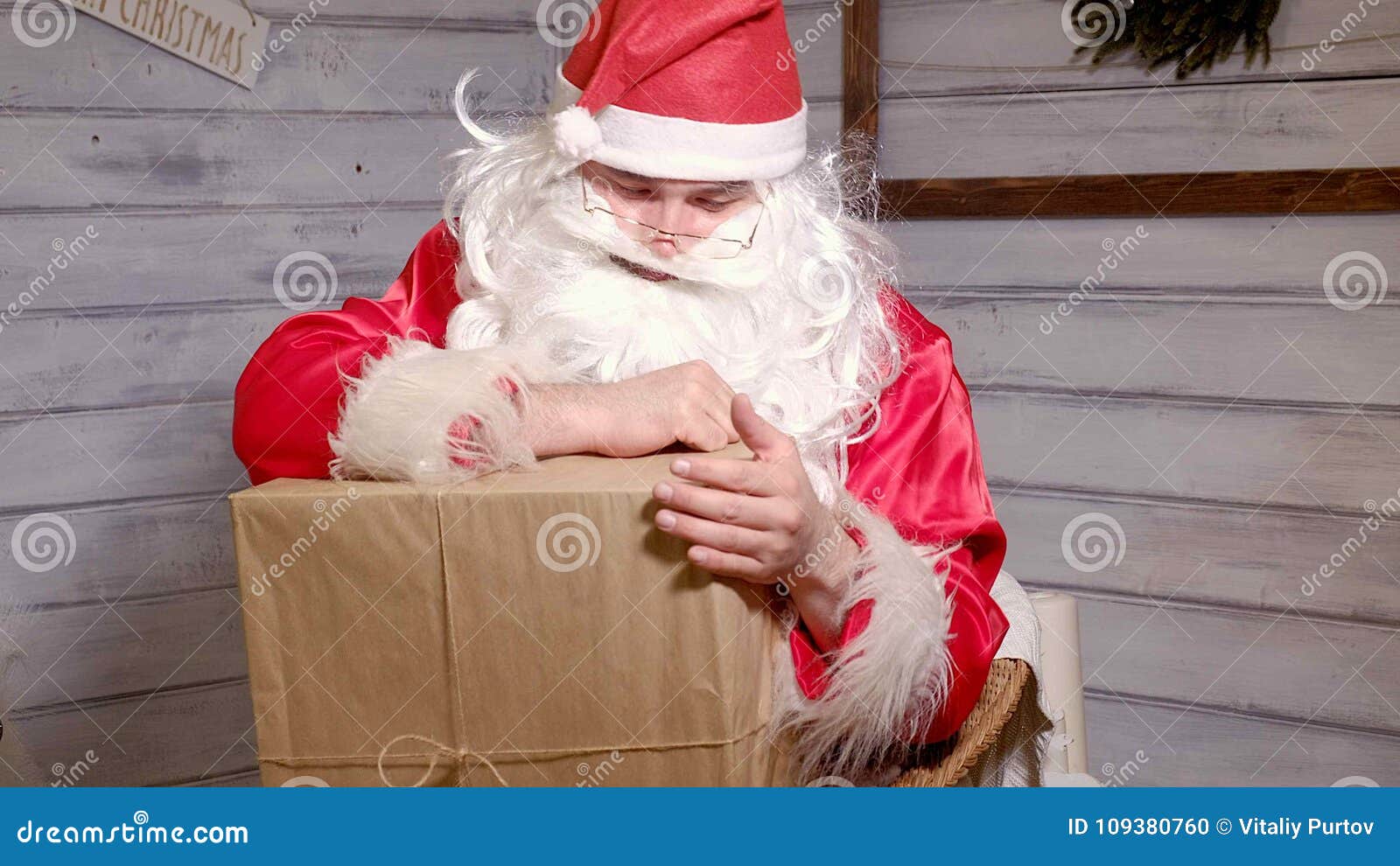 Santa is Holding a Big Gift Box in His Hand Stock Photo - Image of ...