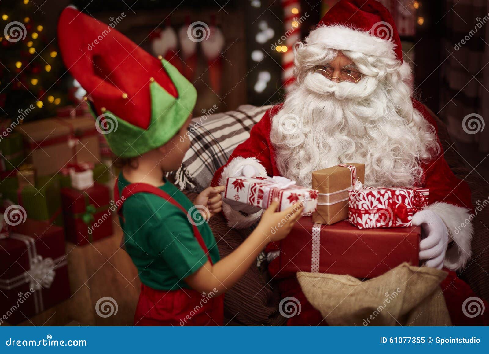 Santa with little boy stock image. Image of pensive, fireplace - 61077355