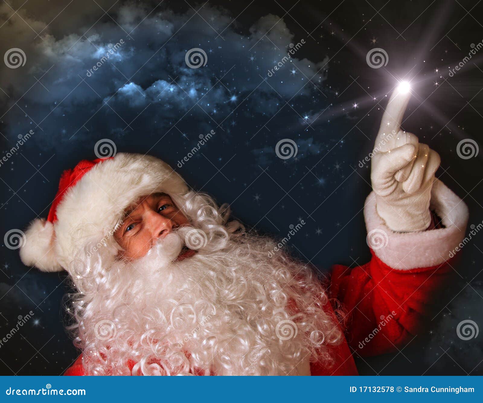 Santa Pointing with Magical Light To the Sky Stock Photo - Image of ...