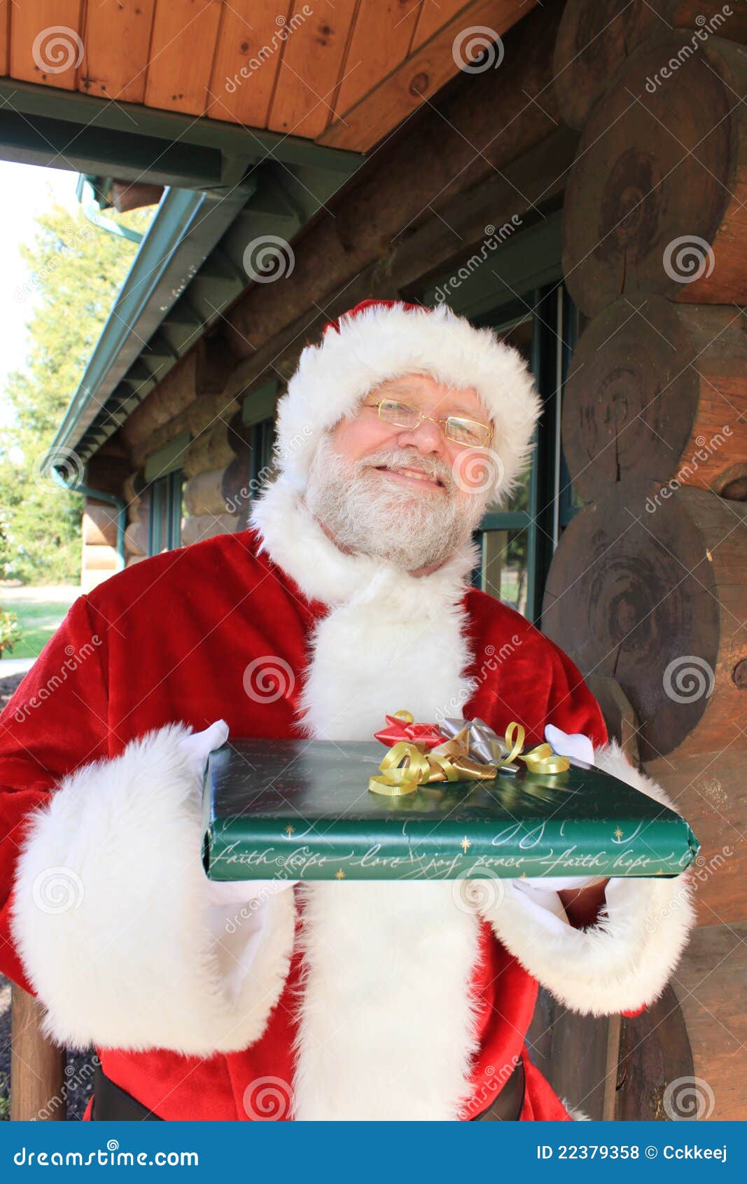 Santa Presenting a Gift stock photo. Image of present - 22379358