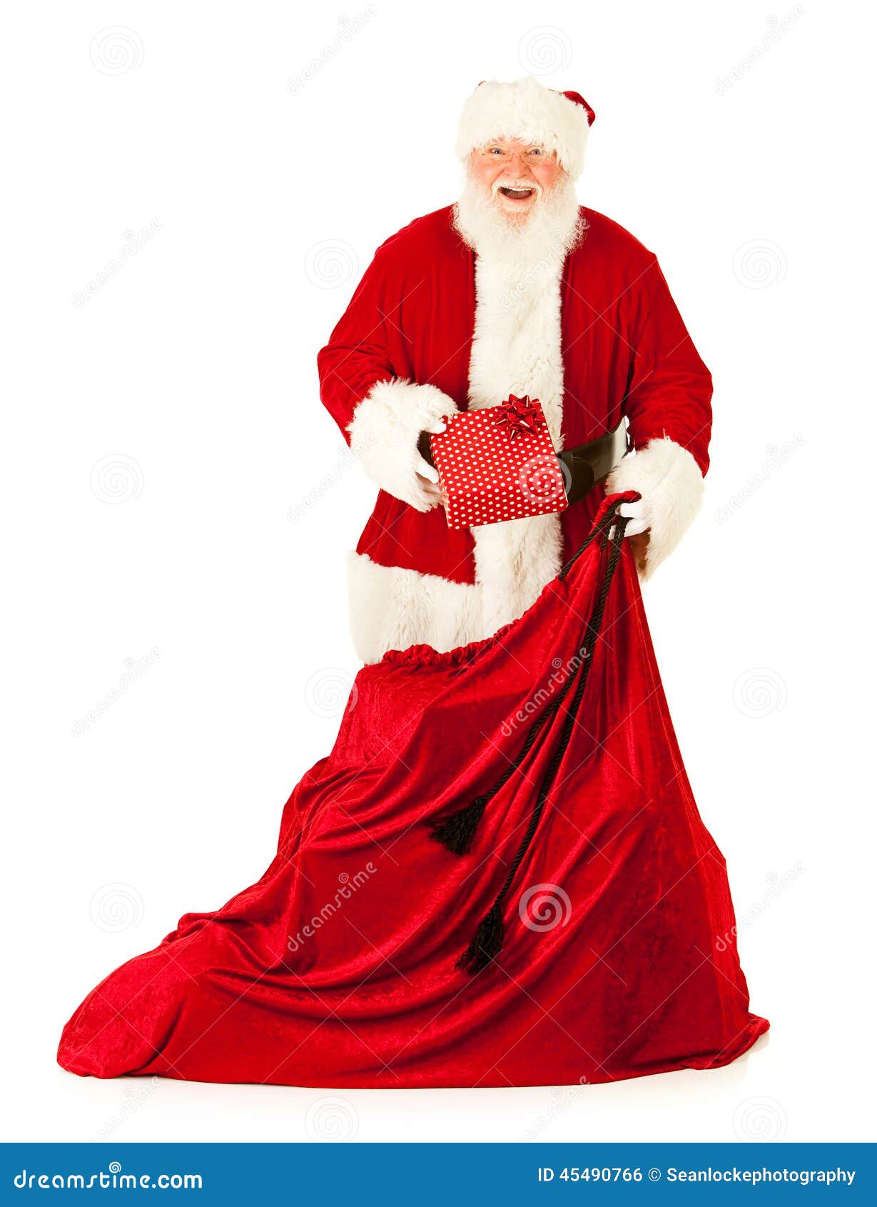 Santa: Pulling a Gift from the Sack Stock Photo - Image of senior ...