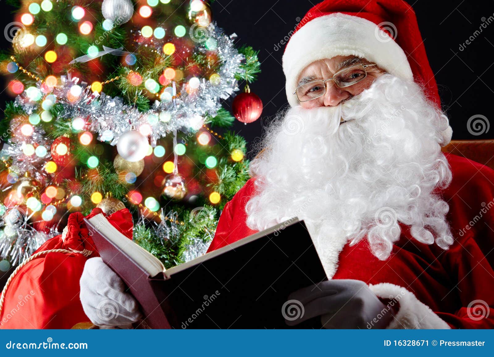 Santa reading a book stock image. Image of sack, noel - 16328671