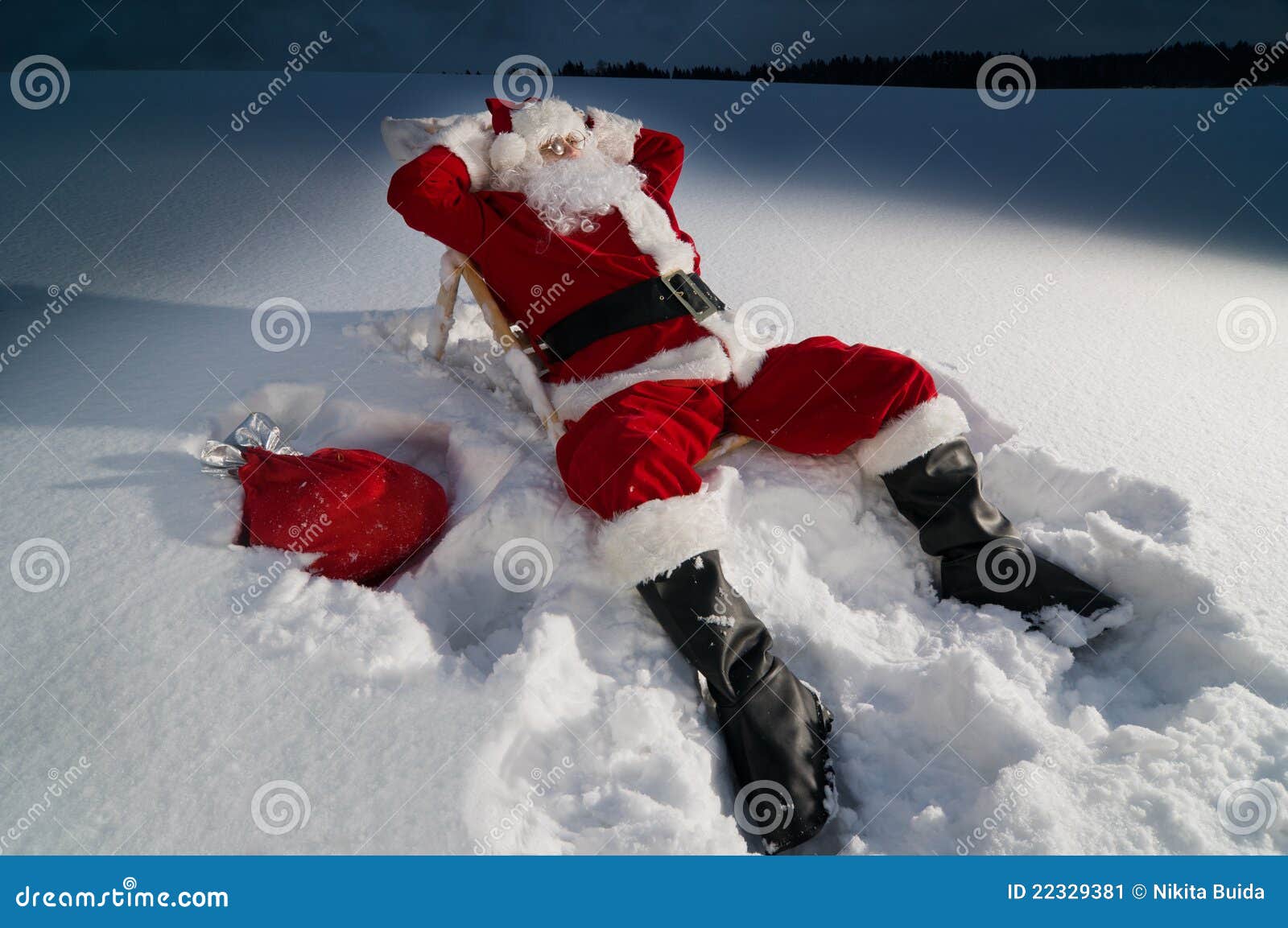 Santa relaxing on a sunbed stock image. Image of night - 22329381