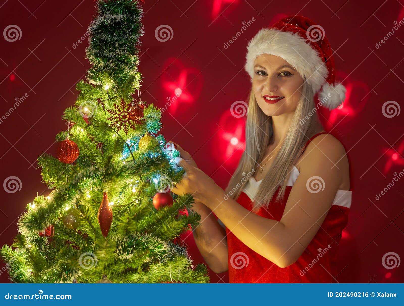 Santa`s Little Helper Decorating the Tree Stock Photo - Image of ...