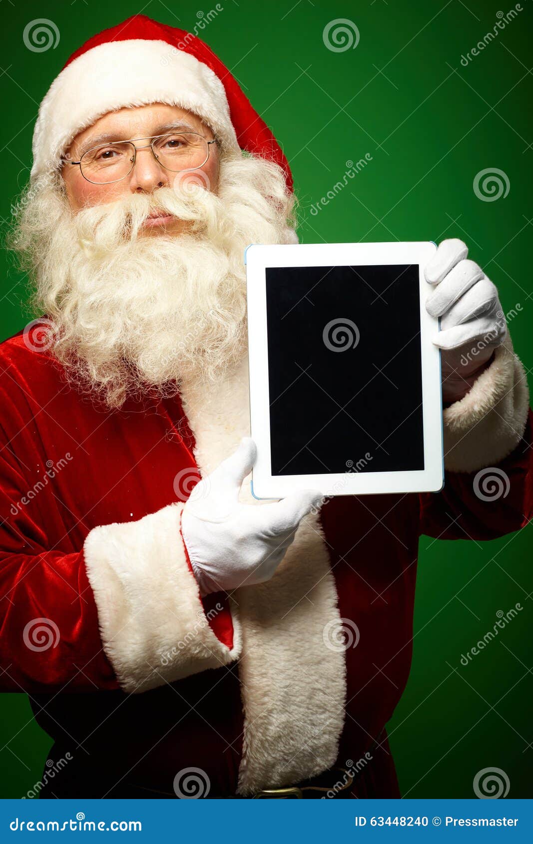 Santa with touchscreen stock photo. Image of tradition - 63448240