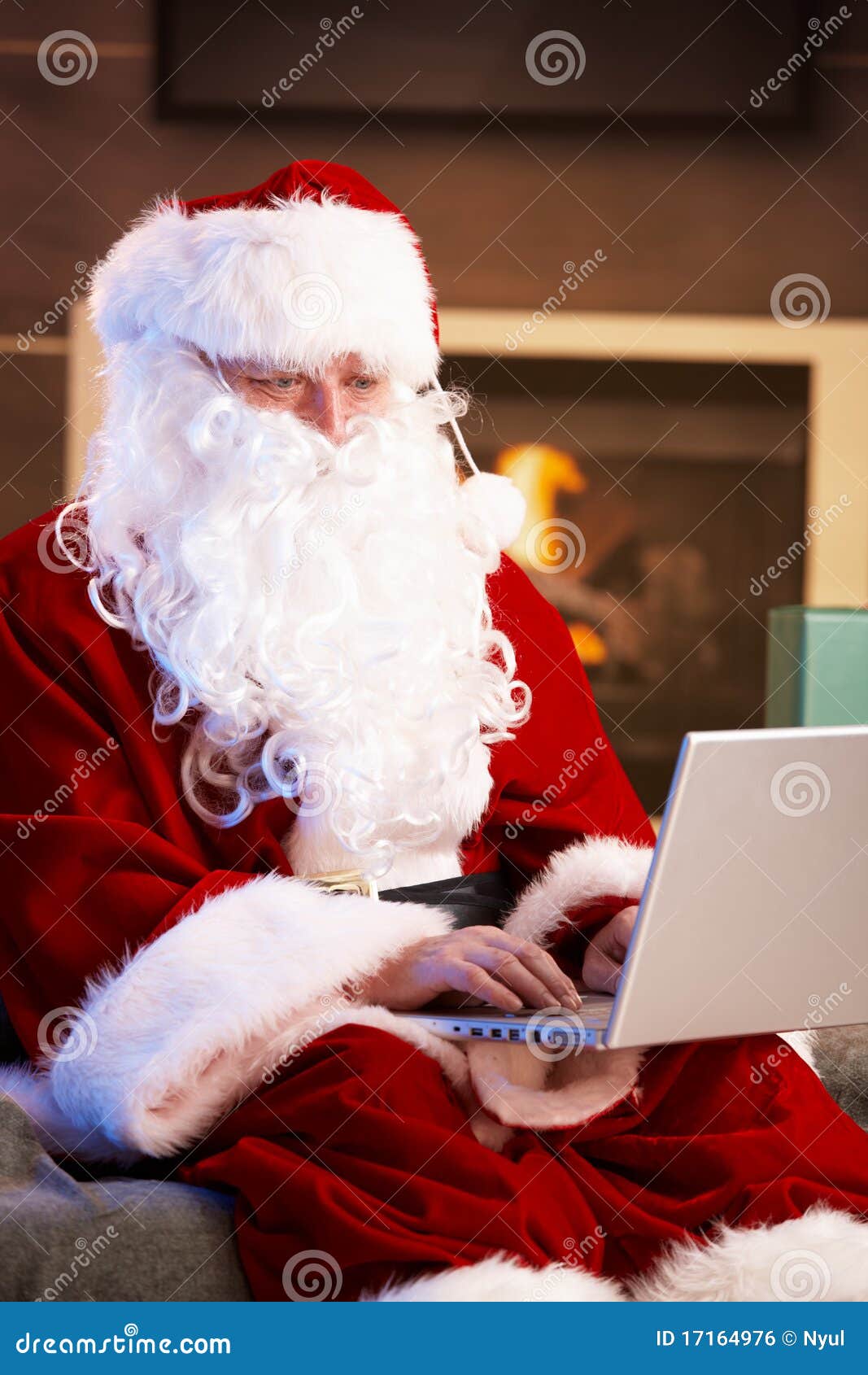 Santa using computer stock photo. Image of holiday, gifts - 17164976