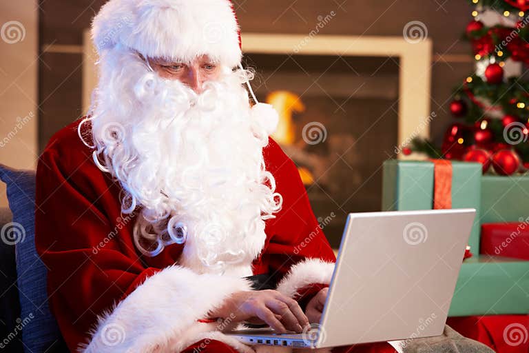 Santa using computer stock image. Image of camera, bearded - 17164983