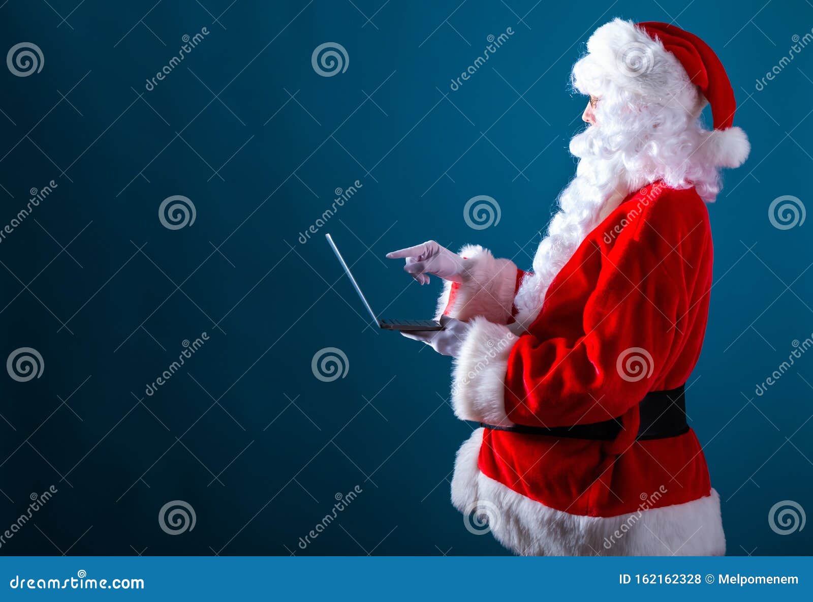 Santa using a laptop stock photo. Image of simplicity - 162162328
