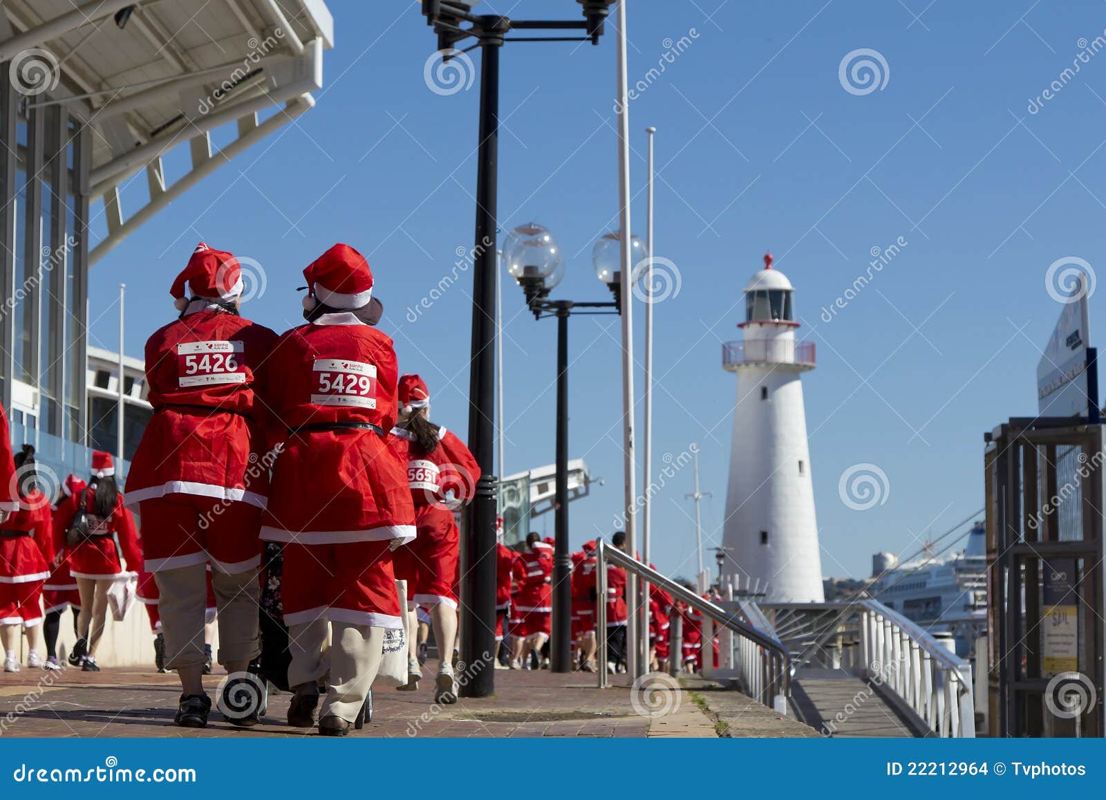 Santas are on a walk. editorial stock image. Image of family - 22212964