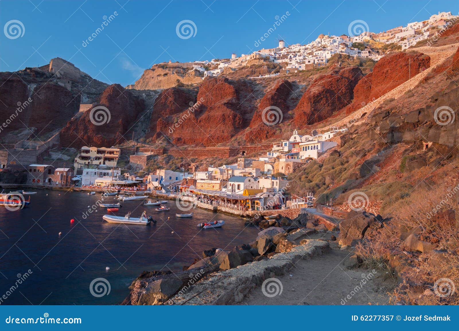 Santorini - the Harbor of Oia in Evening Light. Stock Image - Image of ...