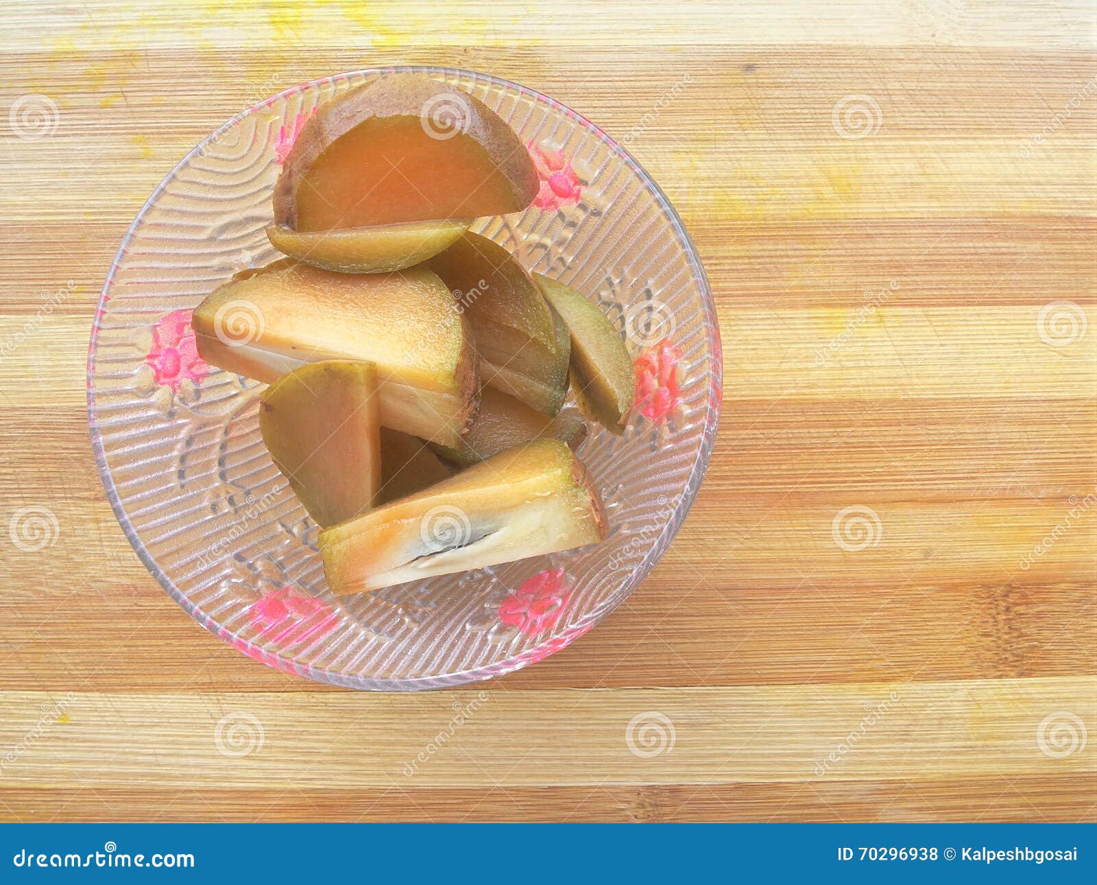 Sapota pieces in bowl stock photo. Image of brown, bowl - 70296938