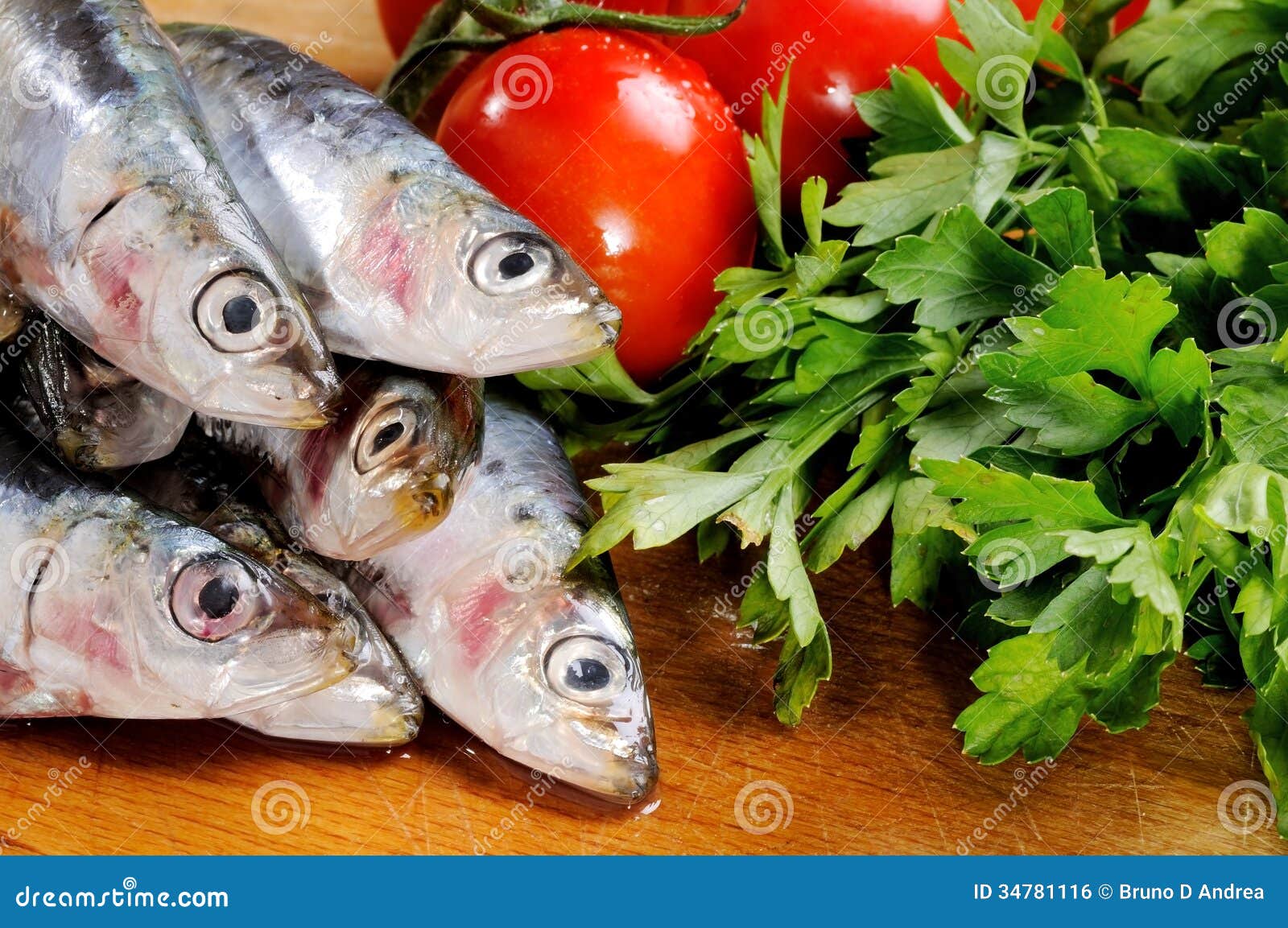 Sardines on Chopping Board stock photo. Image of diet - 34781116