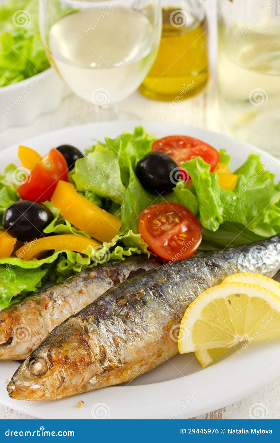Sardines with Lemon and Salad Stock Photo - Image of tomato, salad ...