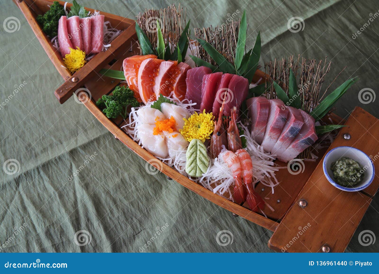 Sashimi set on wooden boat stock photo. Image of closeup - 136961440