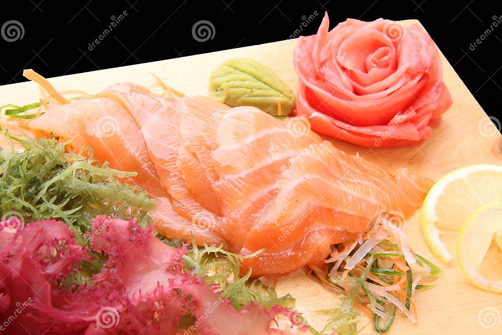 Sashimi syake on a board stock photo. Image of salad - 23498546
